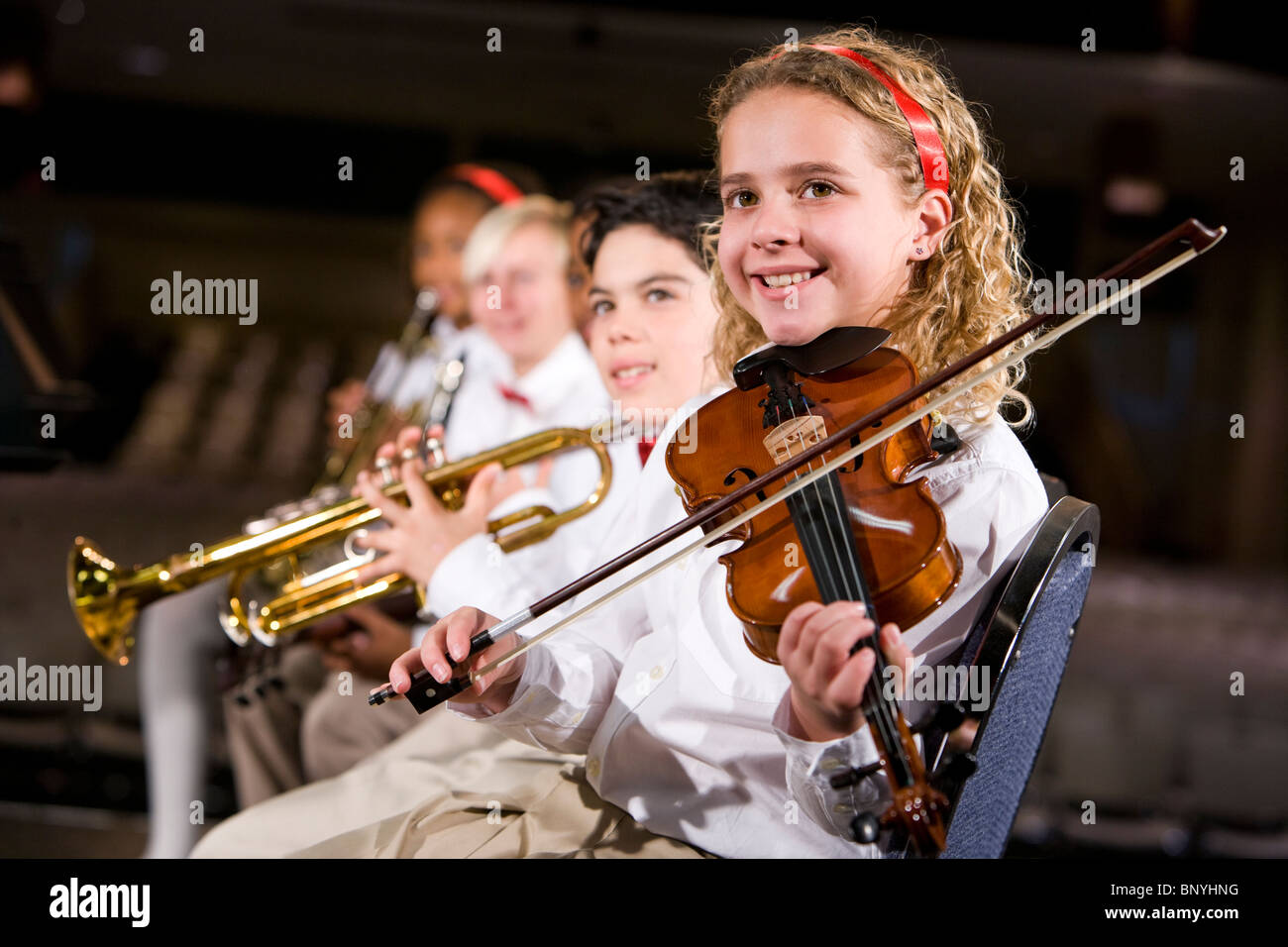 Diverse group of children playing music hi-res stock photography and ...