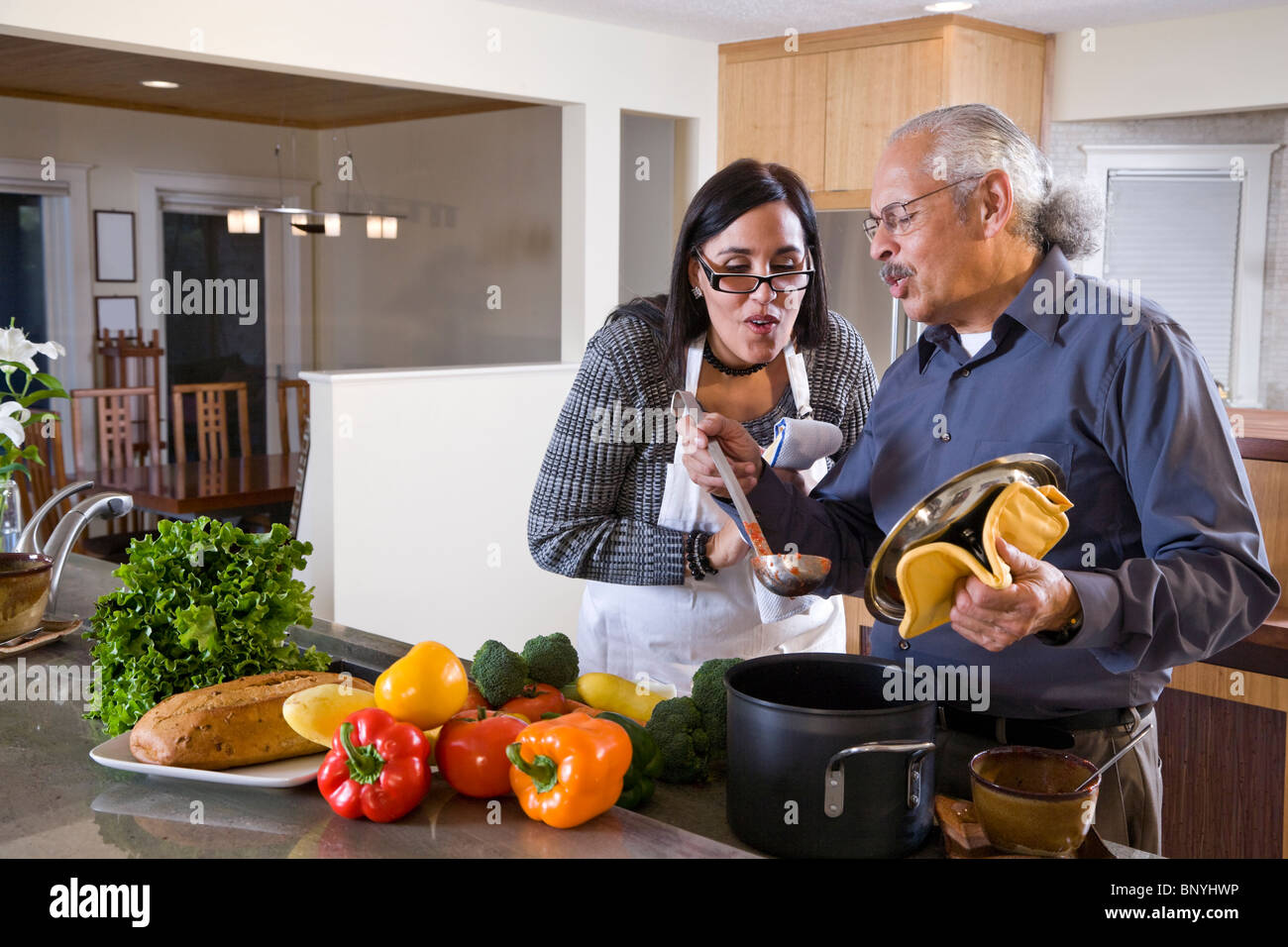 Hispanic family preparing dinner hi-res stock photography and images ...