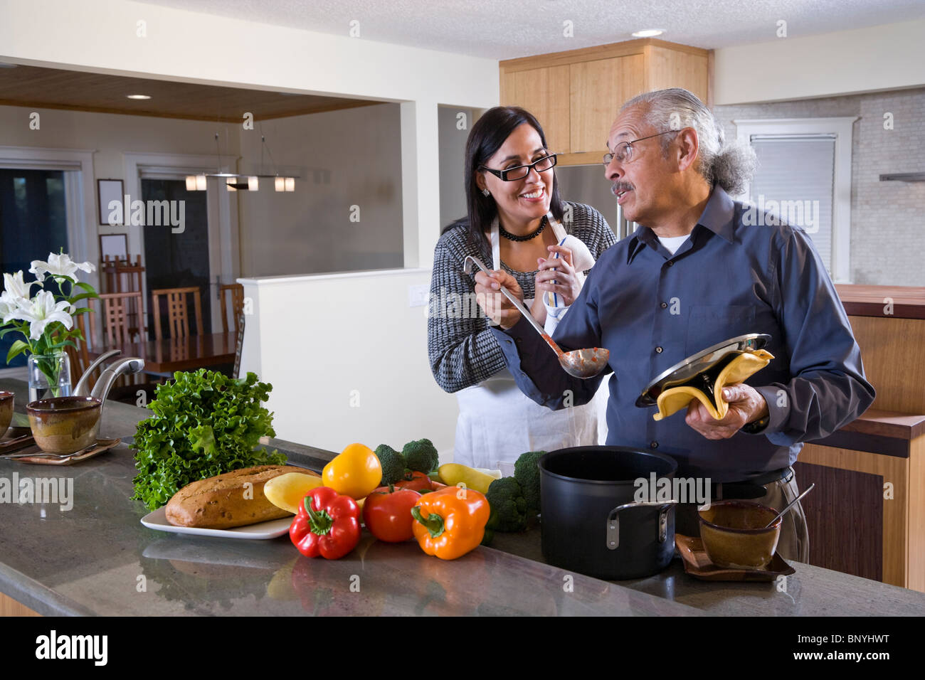 Hispanic family preparing dinner hi-res stock photography and images ...