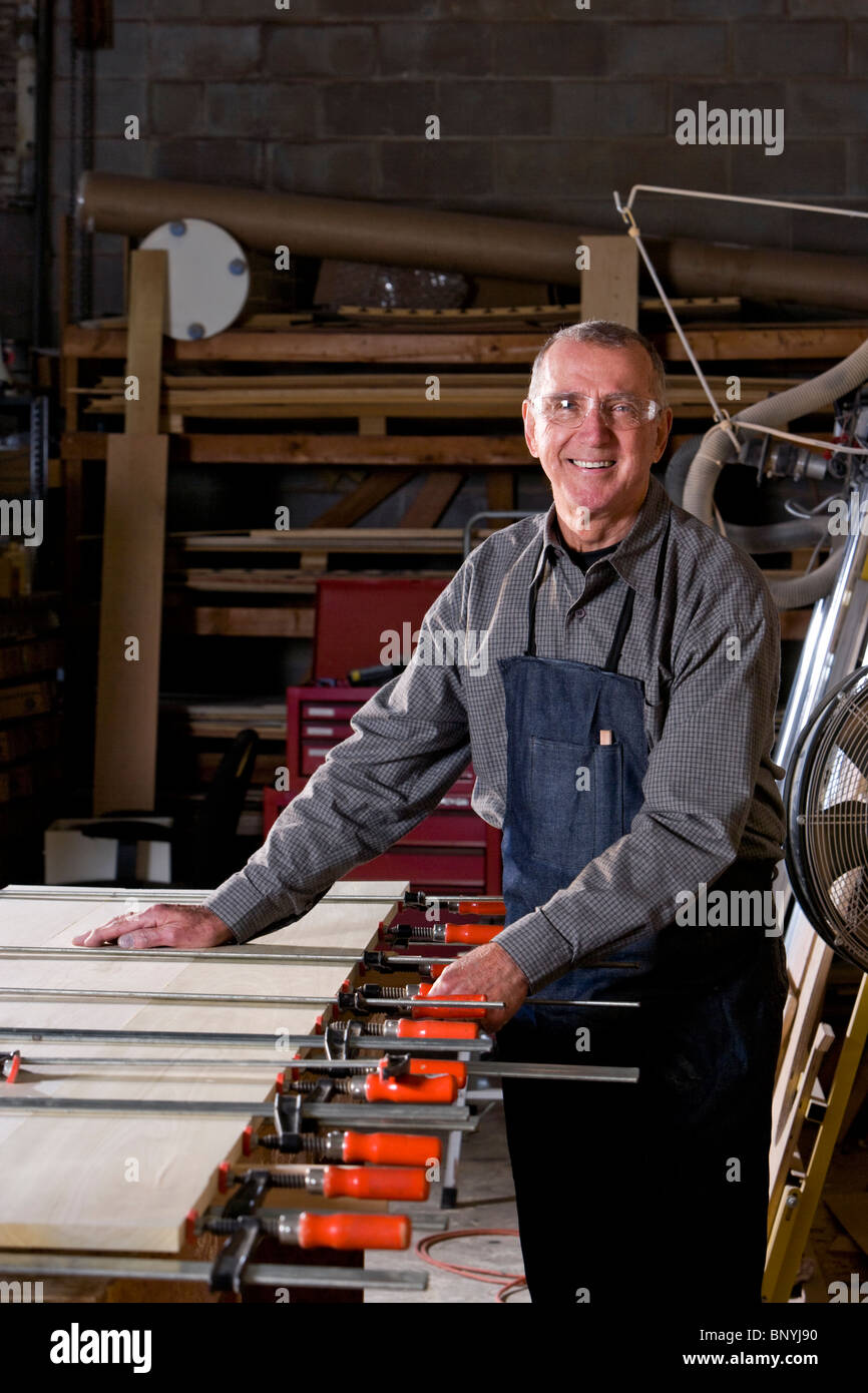 Senior man in woodworking shop Stock Photo - Alamy