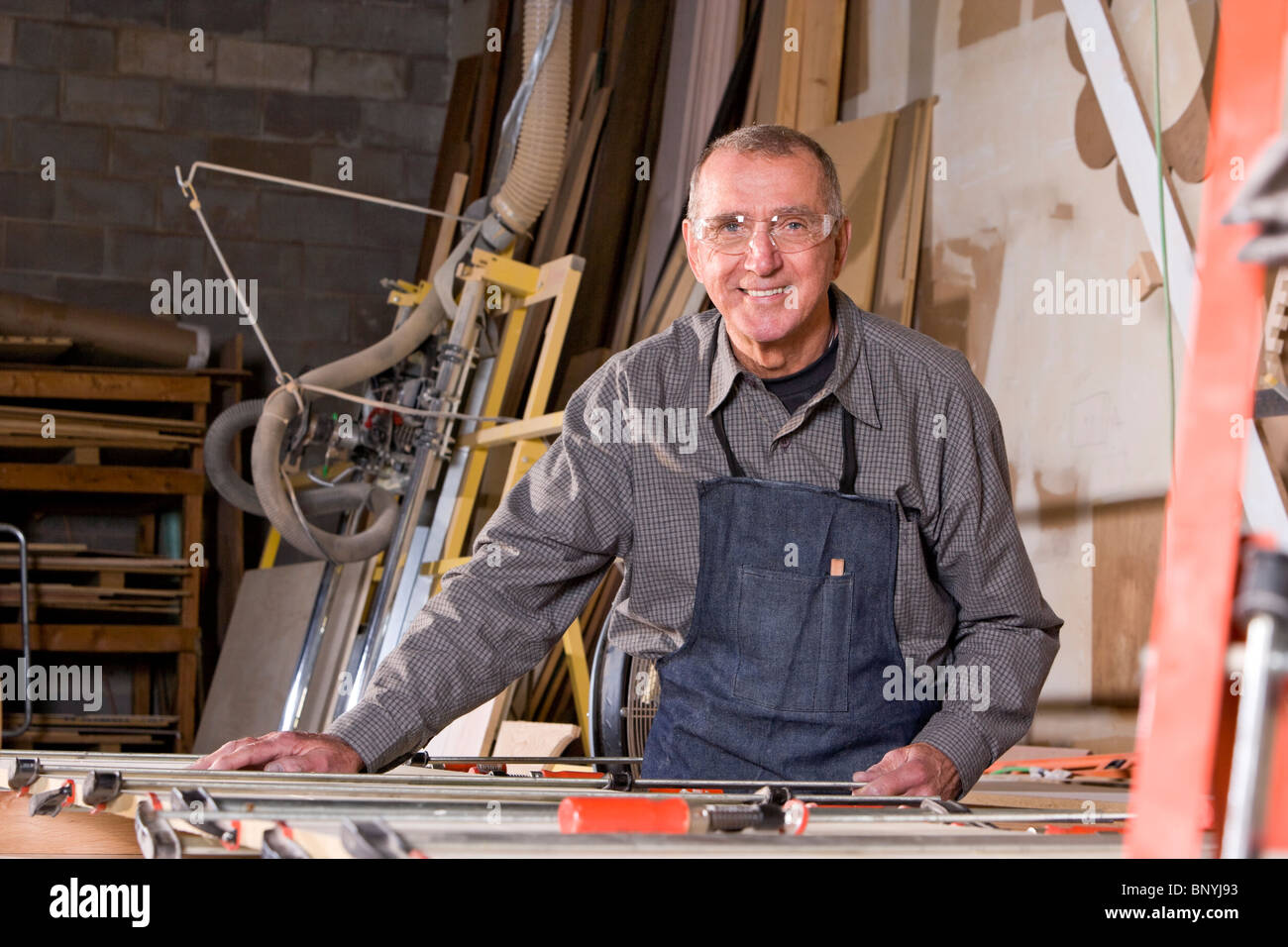 Senior man in woodworking shop Stock Photo - Alamy