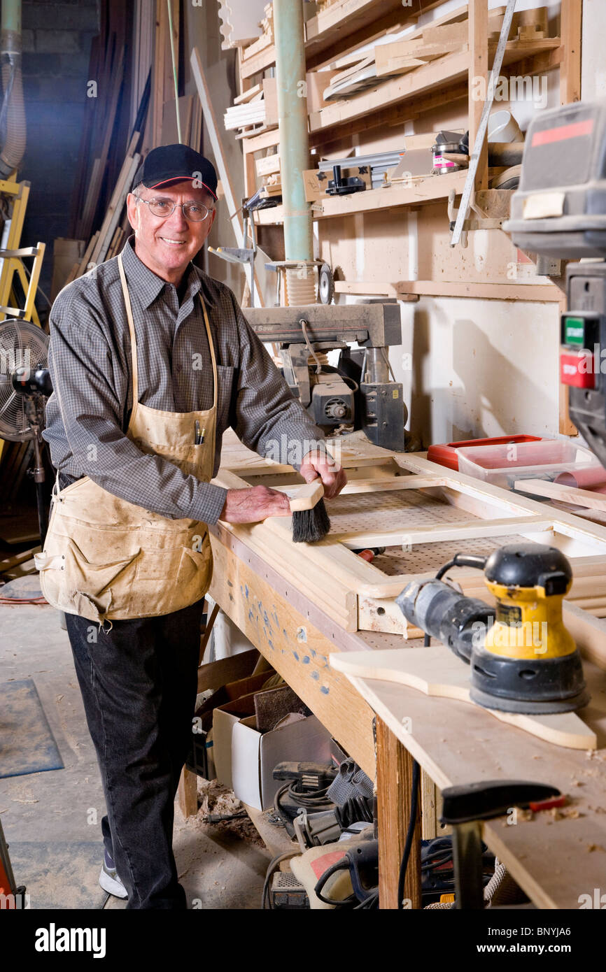 Senior man in woodworking shop working on wood project Stock Photo - Alamy