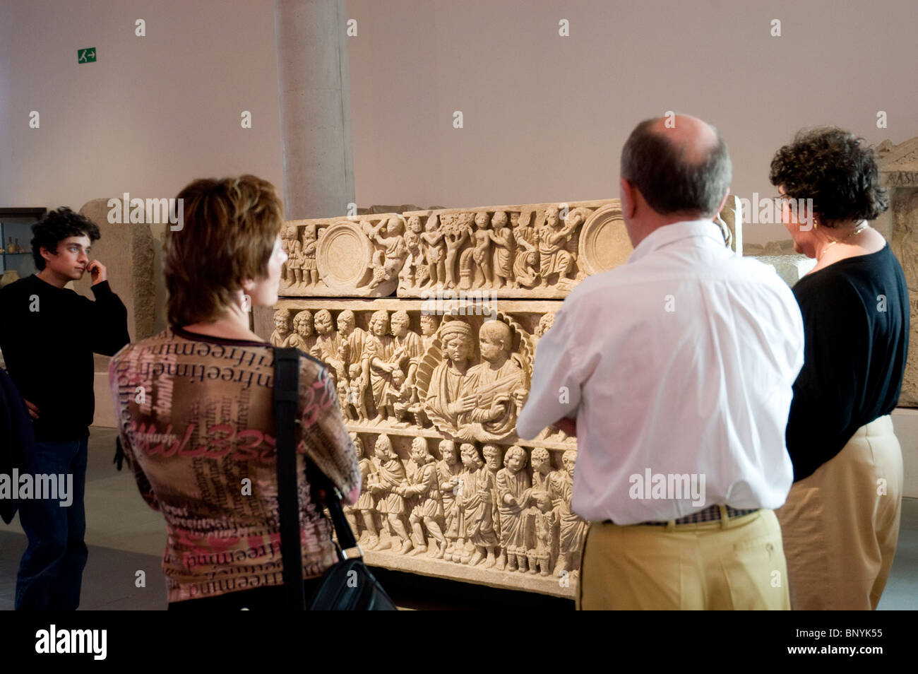 Group Tourists Visiting Arles Archaeological Museum, Tour Guide ...