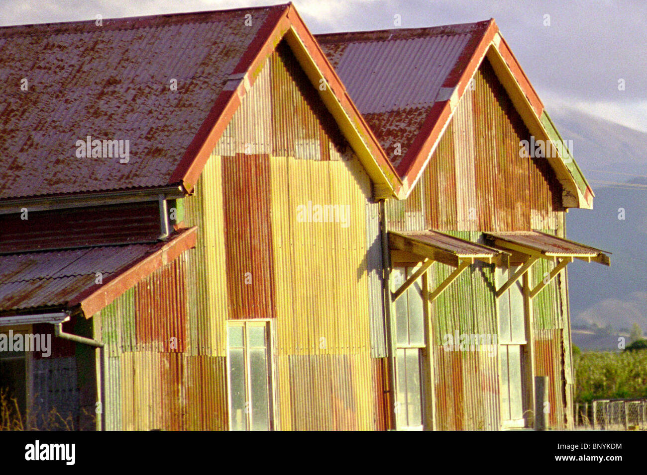 Rusty huts in New Zealand evening sun Stock Photo - Alamy