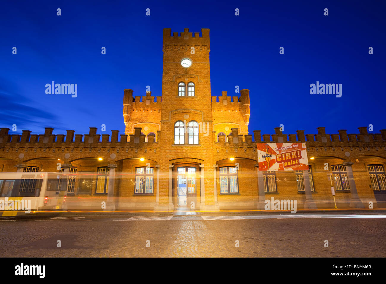 Long exposure shot showing public bus arriving at Aalst's train station ...
