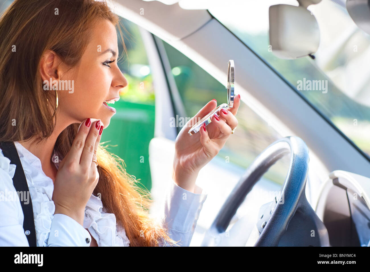 Young woman in car make-up Stock Photo - Alamy