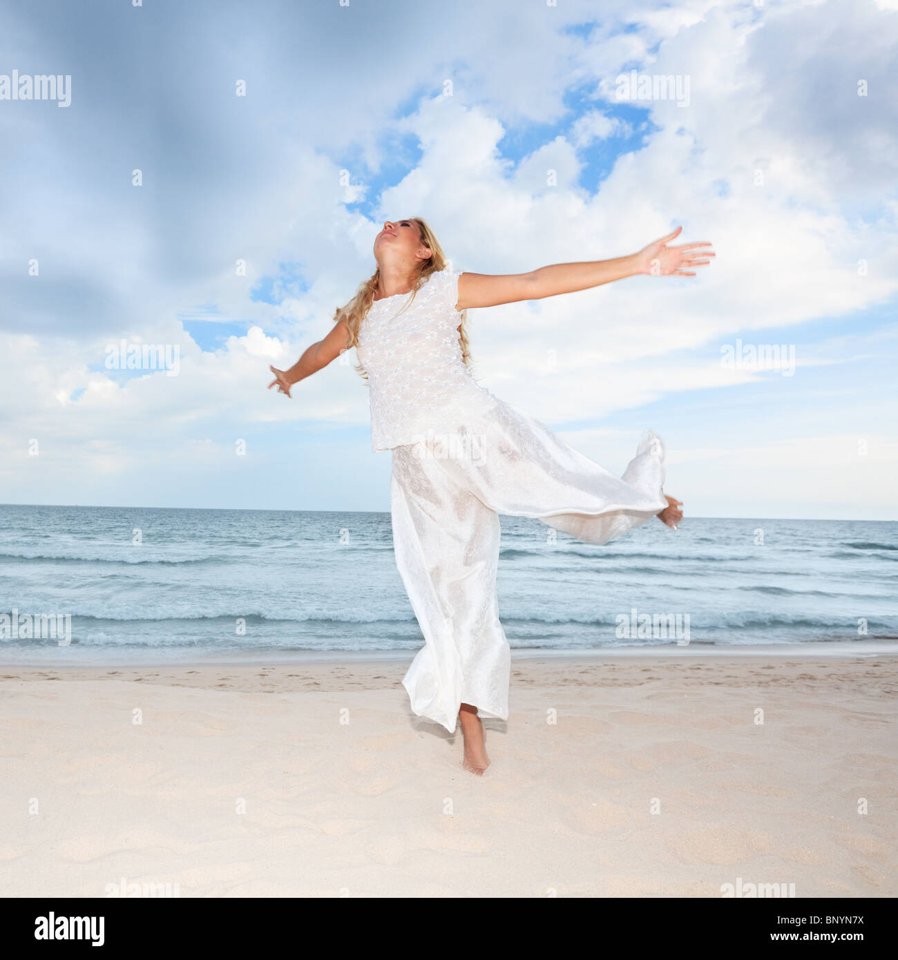 Woman dancing in white hi-res stock photography and images - Alamy