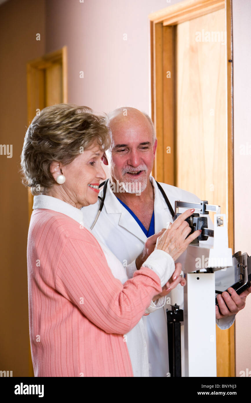 Patient standing on weighing scale hi-res stock photography and images ...