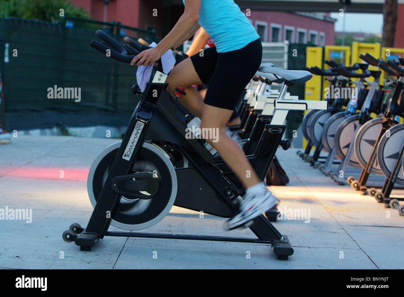 A spinning aerobic young woman during a class lesson in a Fitness ...