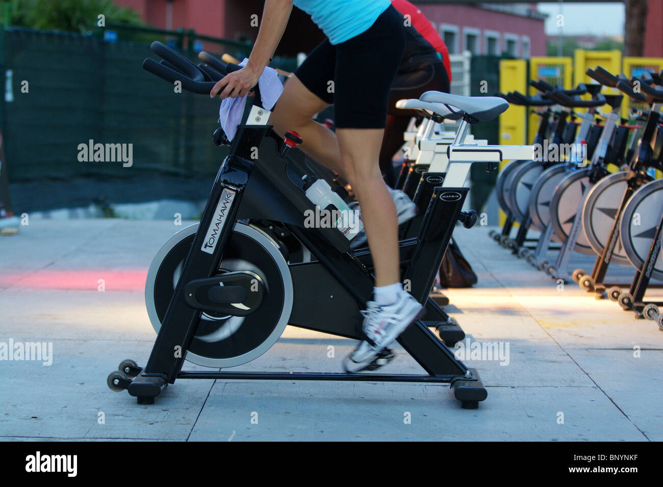 A spinning aerobic young woman during a class lesson in a Fitness ...