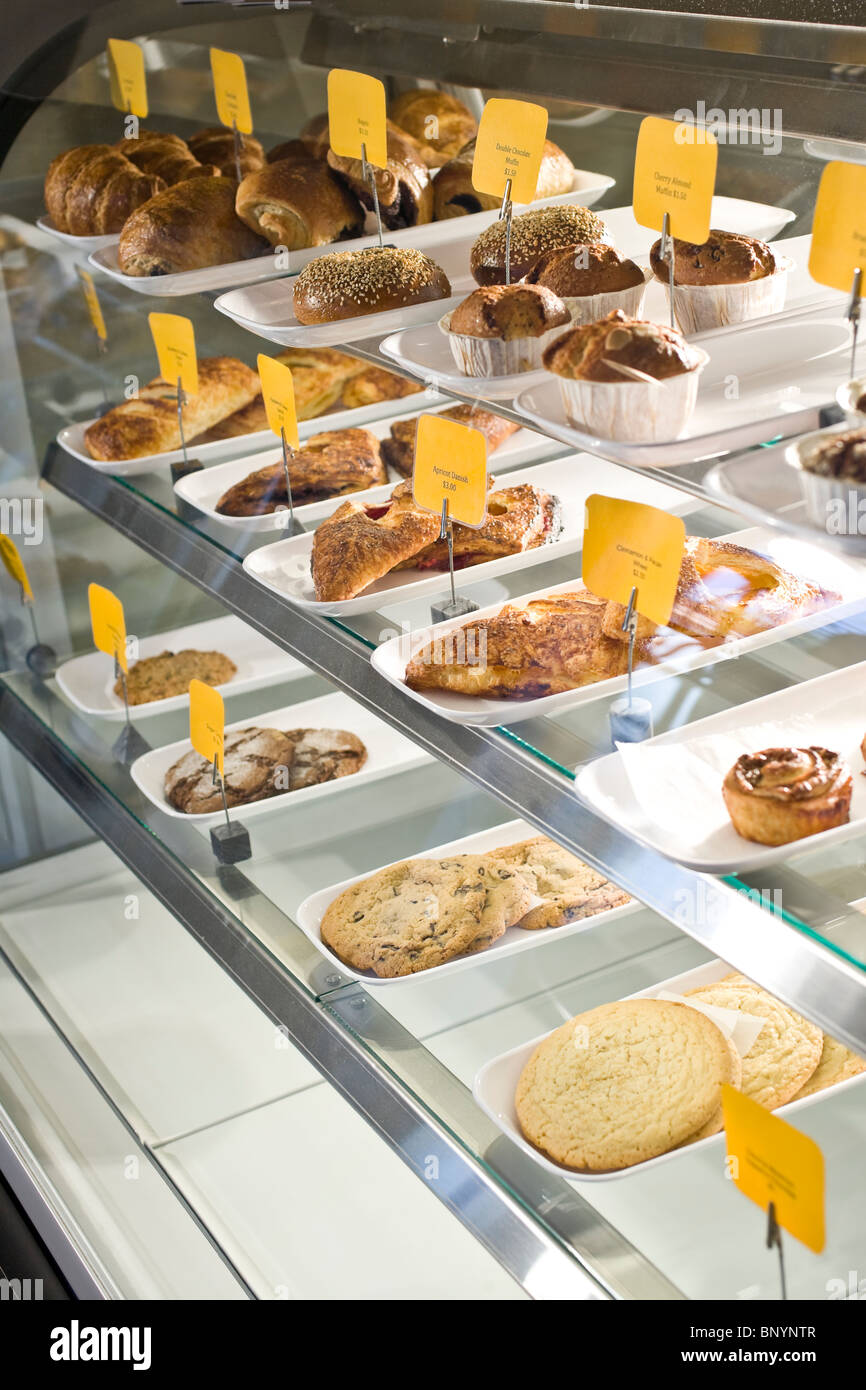 Pastries for sale in bakery display case Stock Photo - Alamy