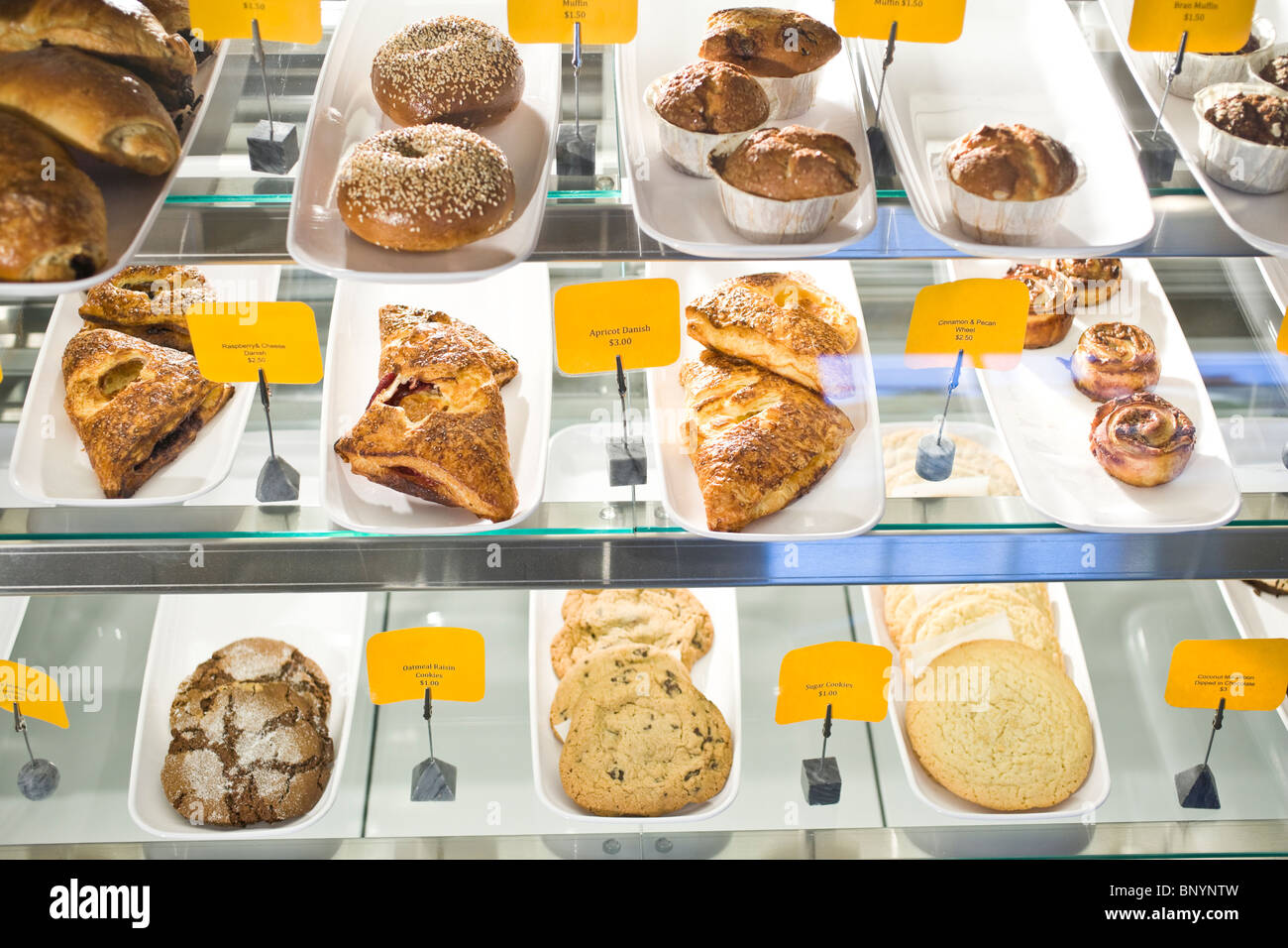 Pastries for sale in bakery display case Stock Photo - Alamy