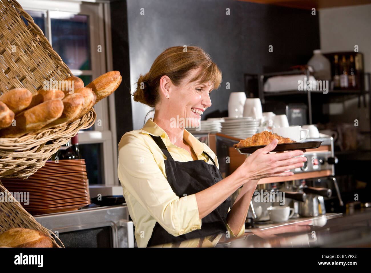 Waitress in coffee shop with customer order Stock Photo - Alamy