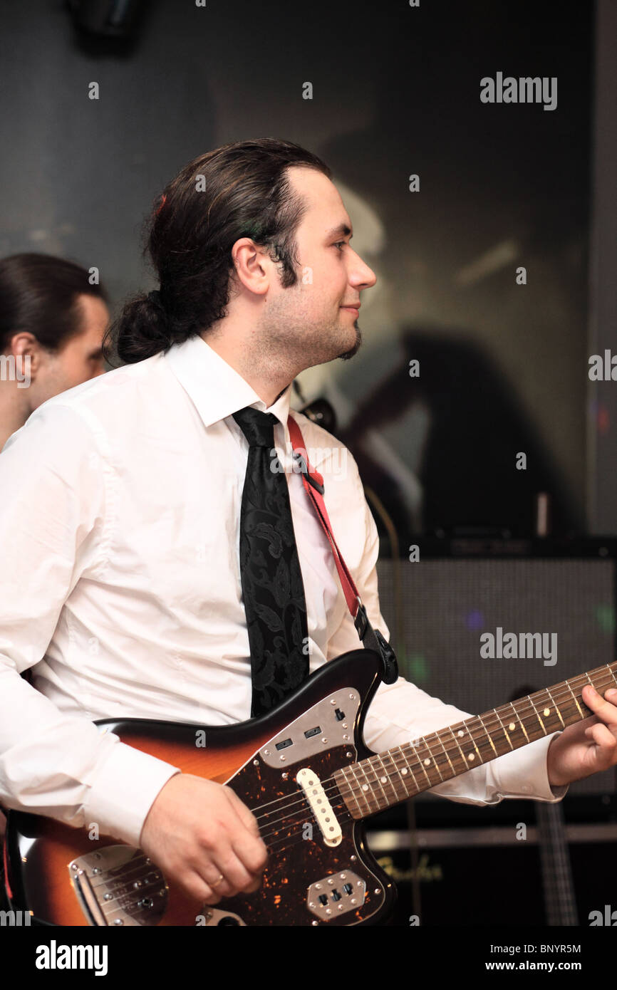 guitarist in nightclub with electrical guitar Stock Photo - Alamy