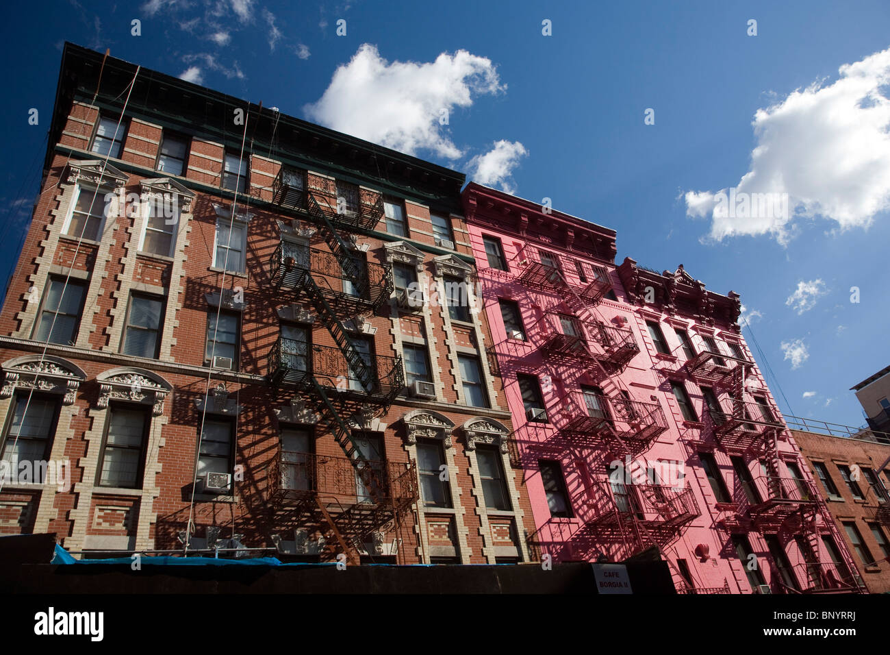 Typical American residential building with fire escape stairs, New York ...