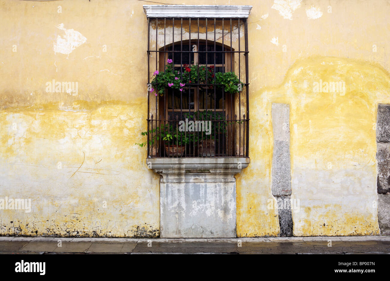 Typical decorative windows in the wall of a colonial style building in ...