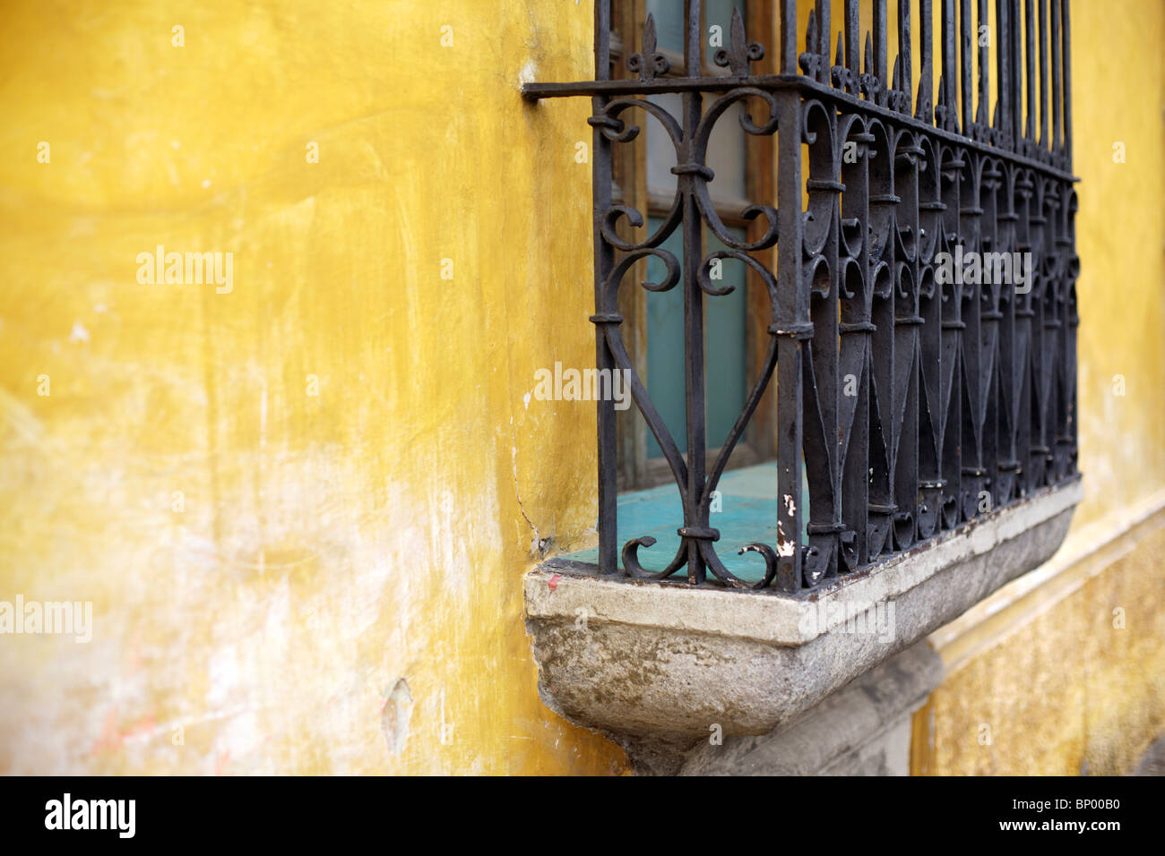 Typical decorative windows in the wall of a colonial style building in ...