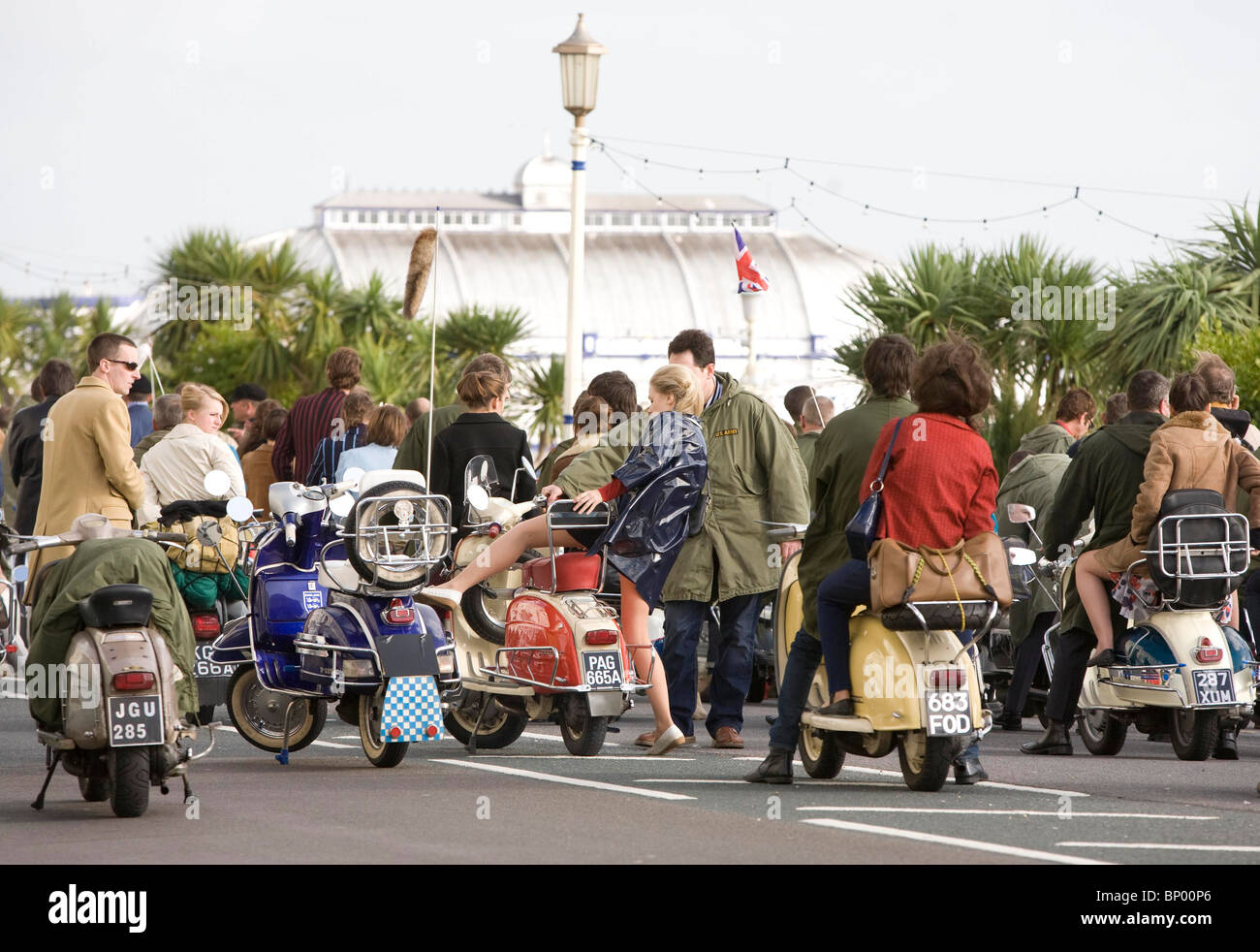 Film extras ride along Eastbourne Seafront on scooters during the ...