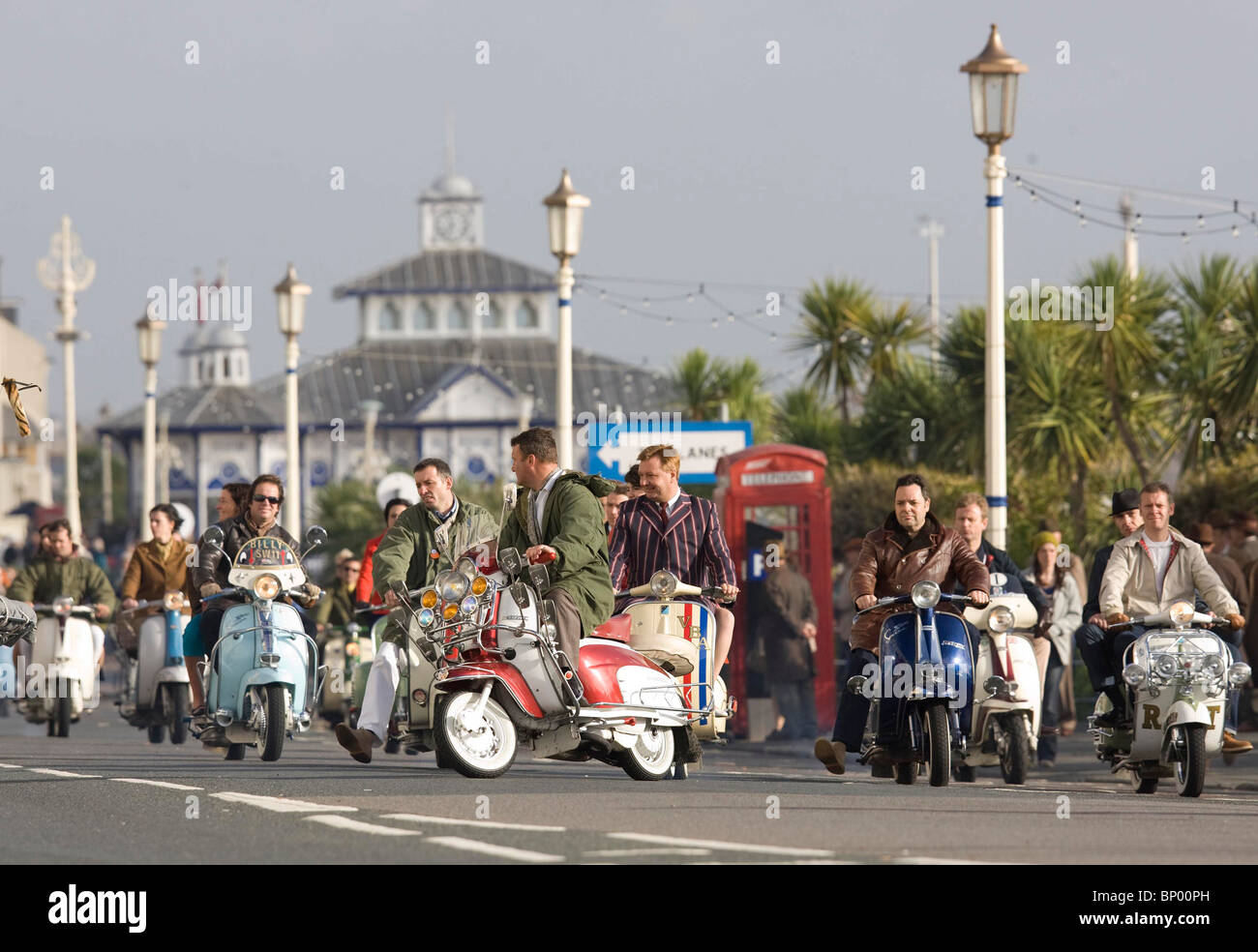 Film extras ride along Eastbourne Seafront on scooters during the ...