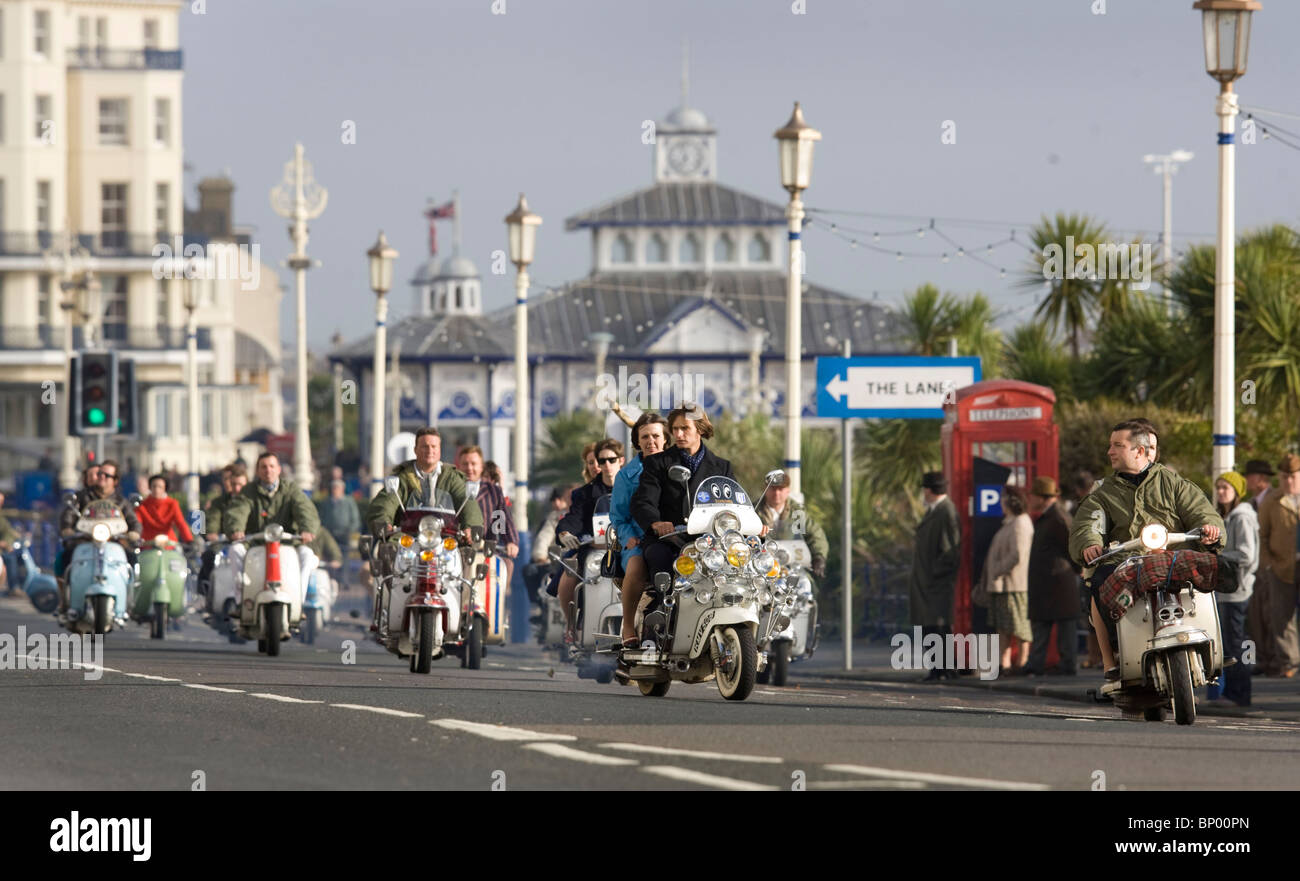 Film extras ride along Eastbourne Seafront on scooters during the ...