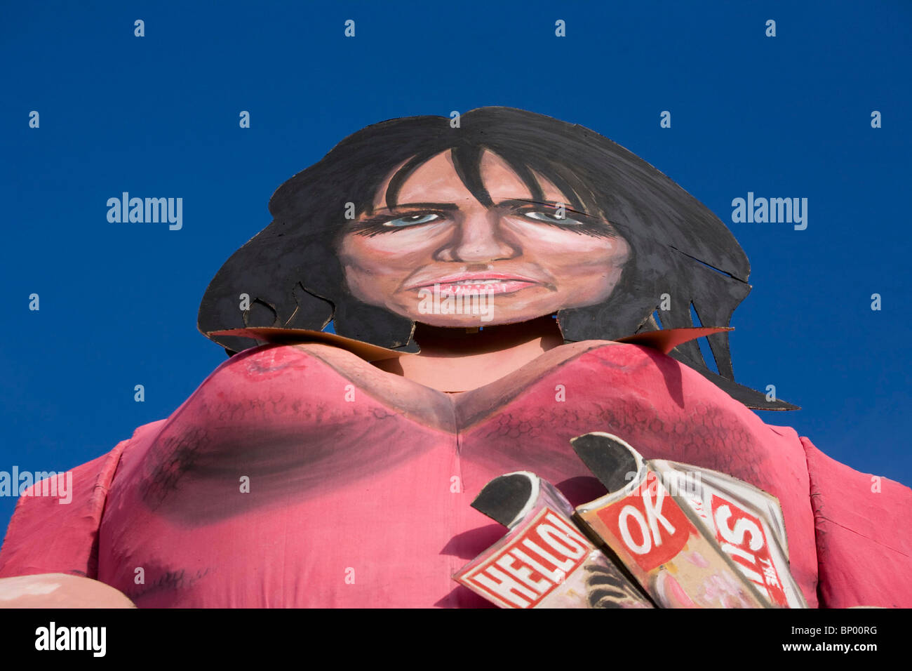 Artist Frank Shepherd puts the final touches to a giant effigy of ...