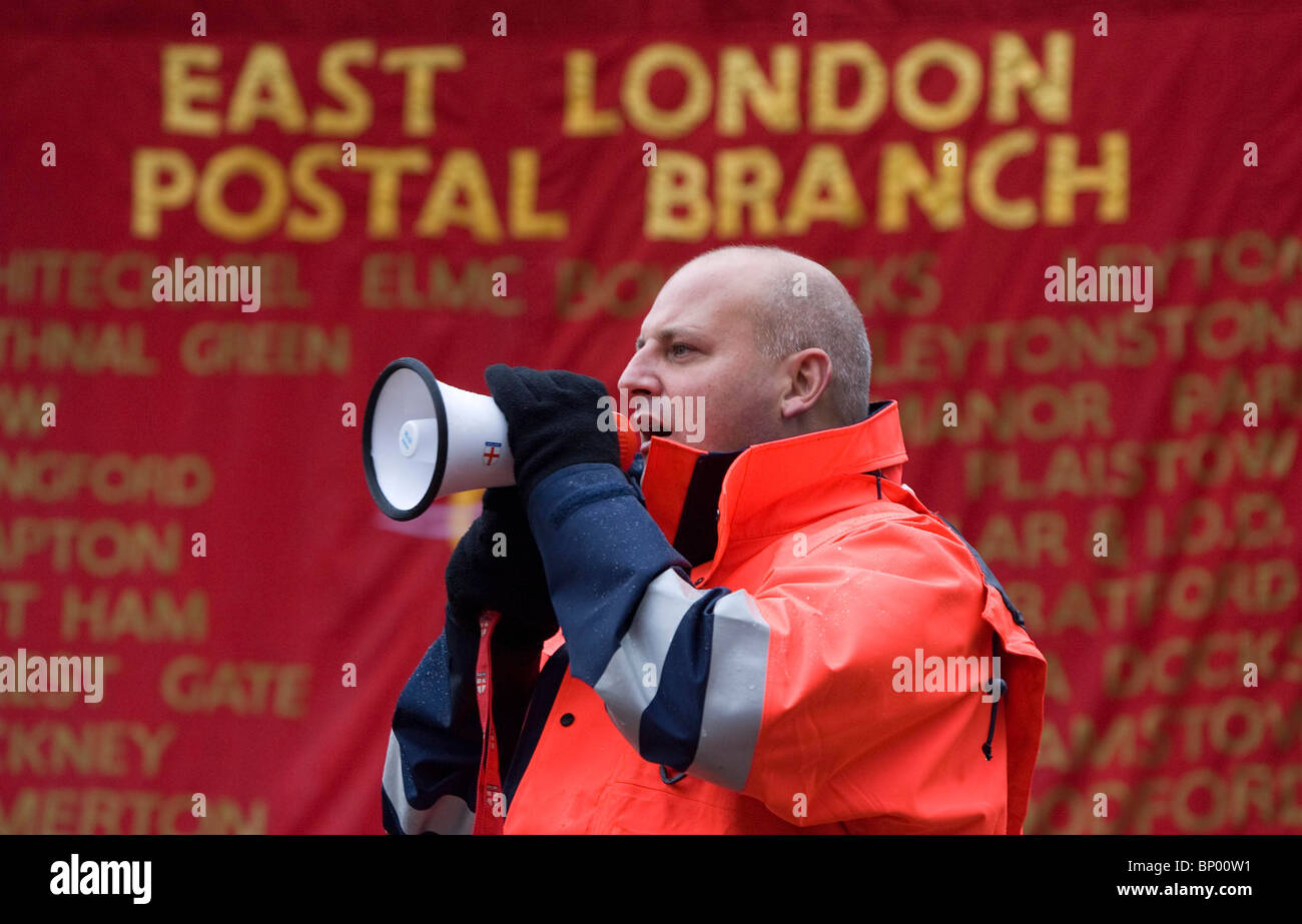 A striking Postal Worker pickets outside Bow Delivery Office in East ...
