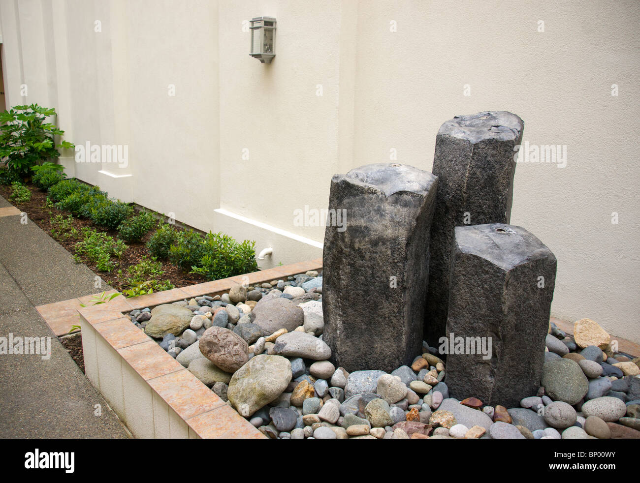 Rock formations and garden fountain Stock Photo - Alamy