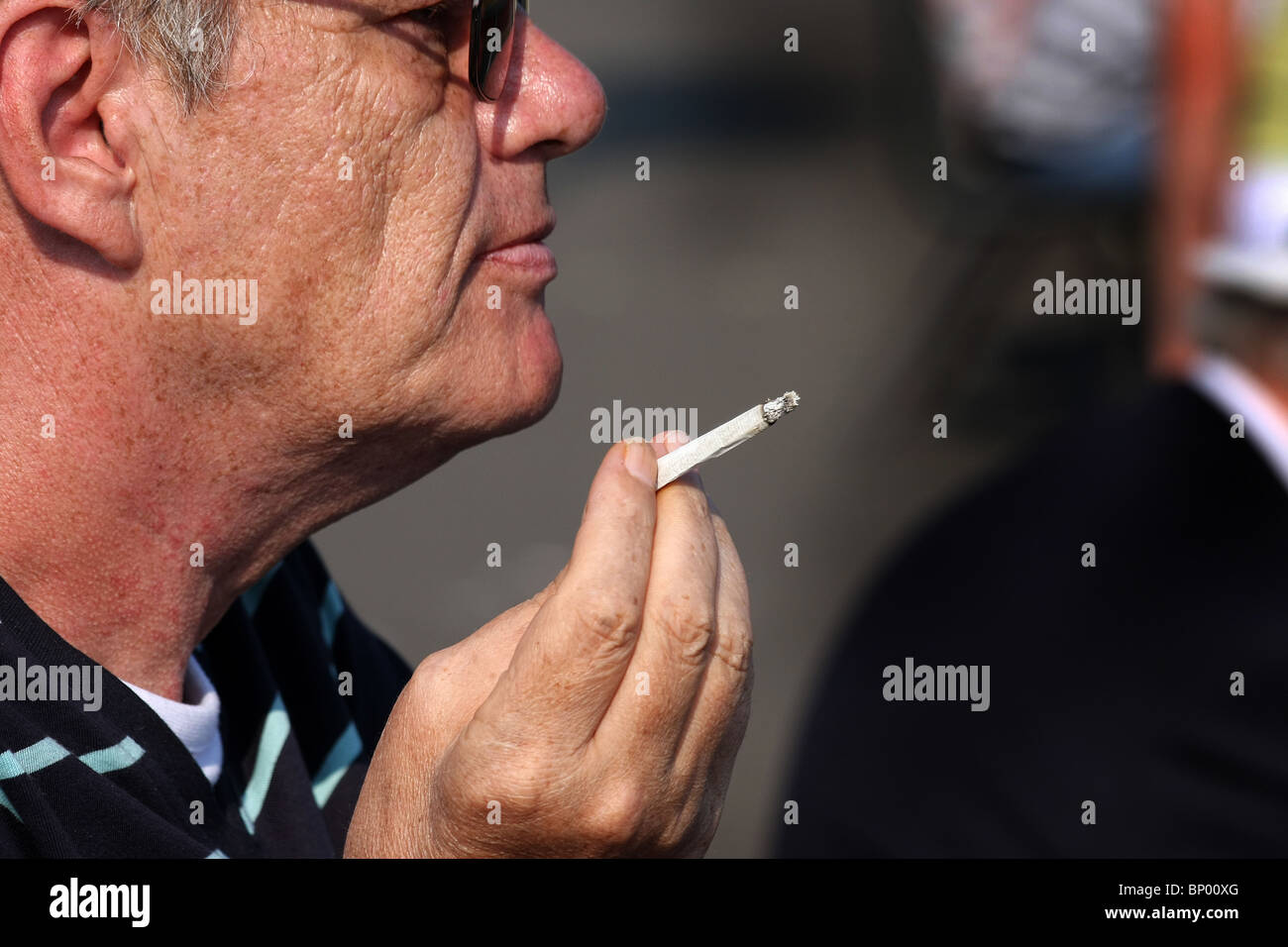 Man smoking outdoors hi-res stock photography and images - Alamy