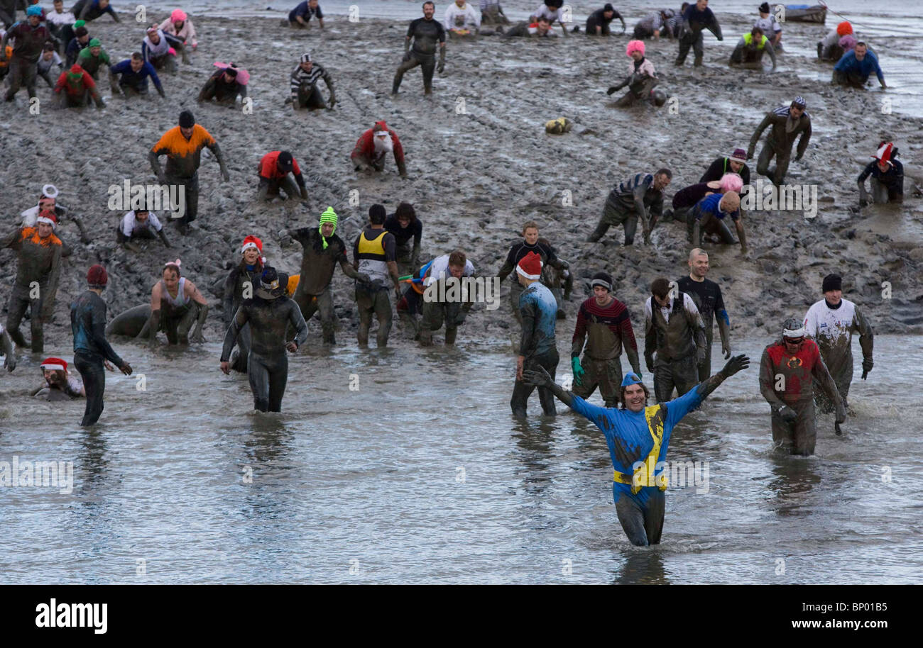 Mud covered Competitors near the finish line during the Maldon Mud Race ...