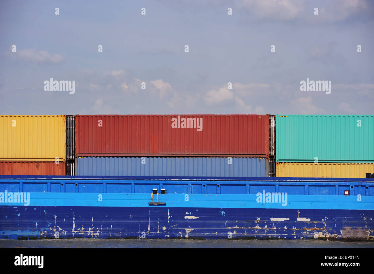 Colorful cargo containers stacked on the deck of a ship Stock Photo - Alamy