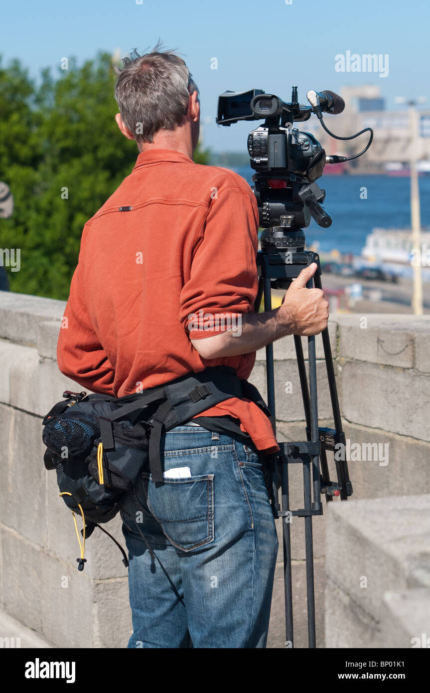 man with the video camera Stock Photo - Alamy