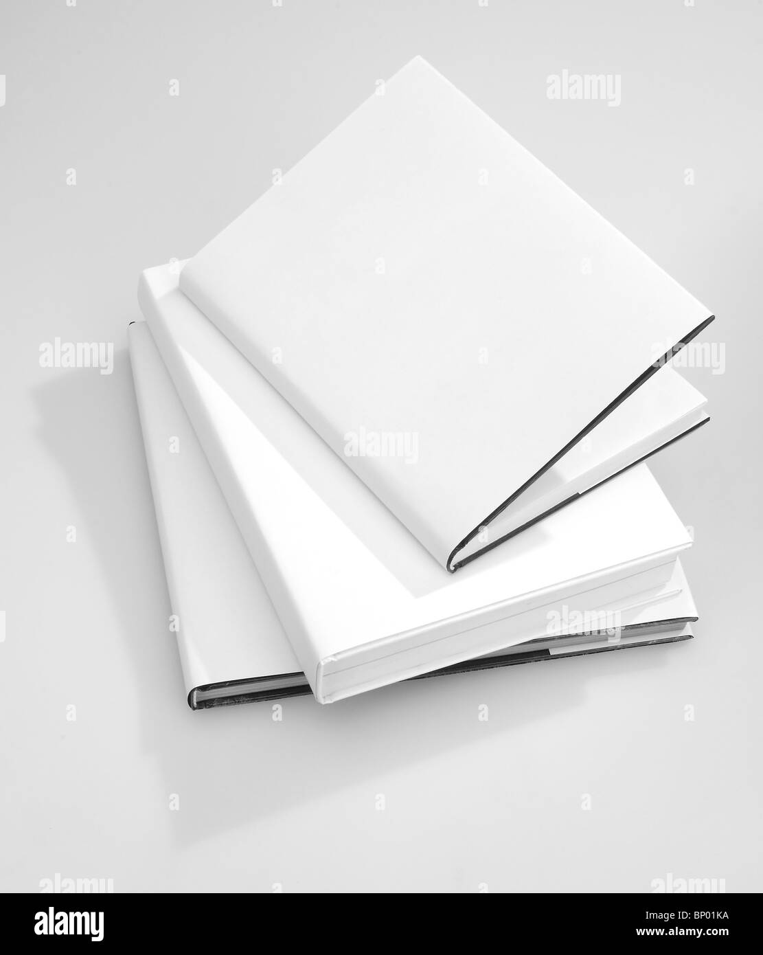 Three Blank book cover white Stock Photo - Alamy