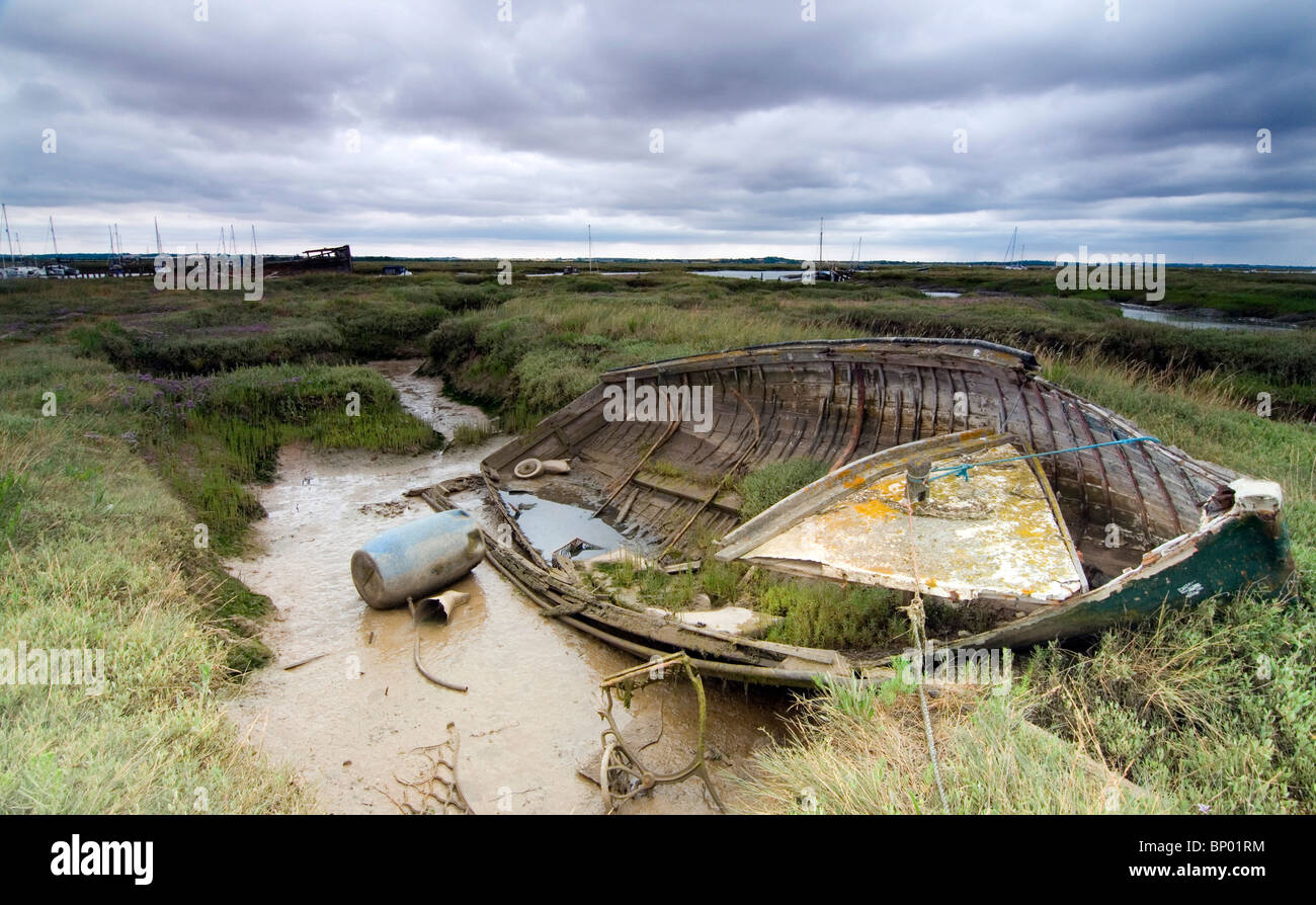Old disused wooden boat in the mud flats and salt marshes at Tollesbury ...