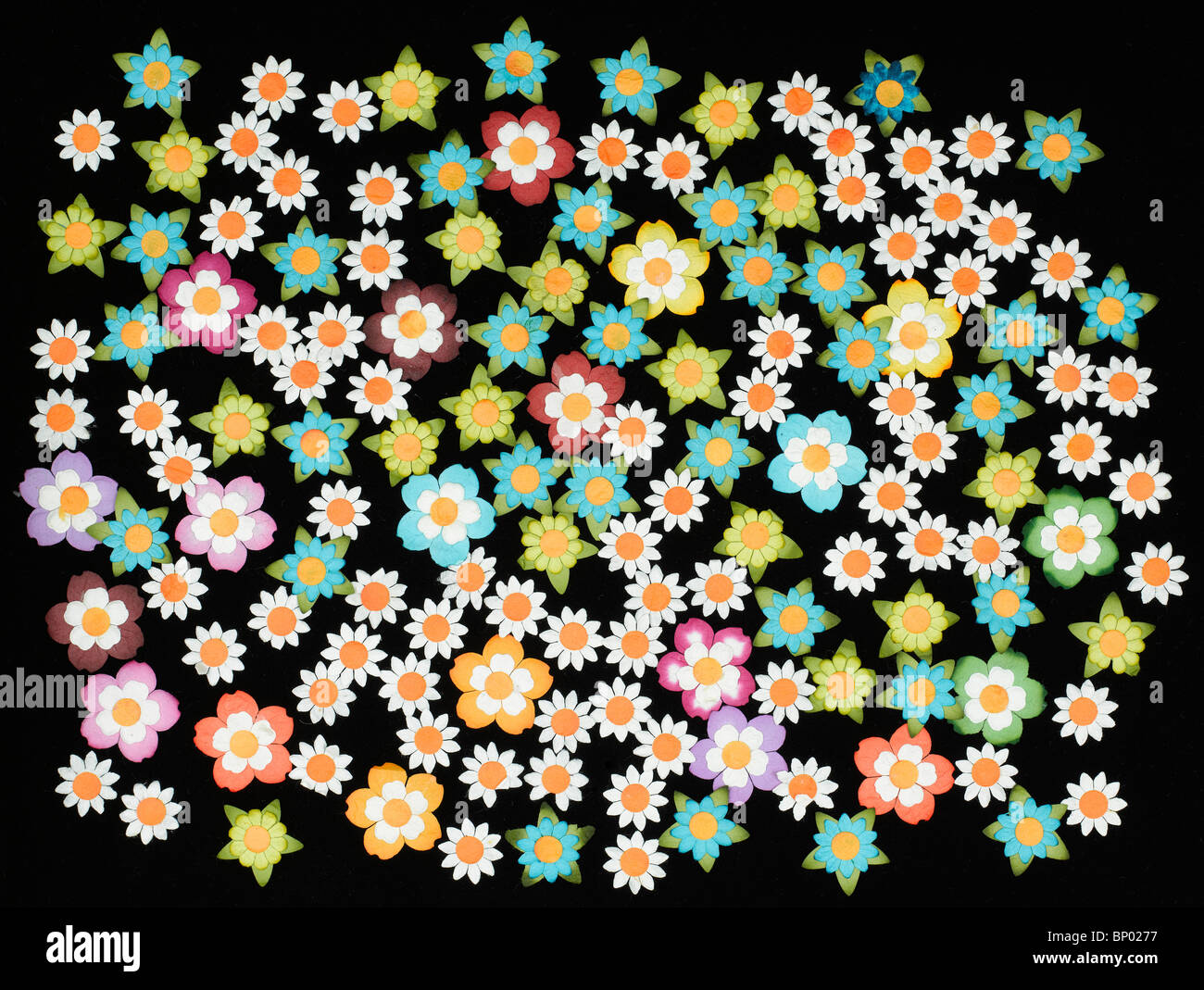 Collection of small paper flowers over black background (large format ...