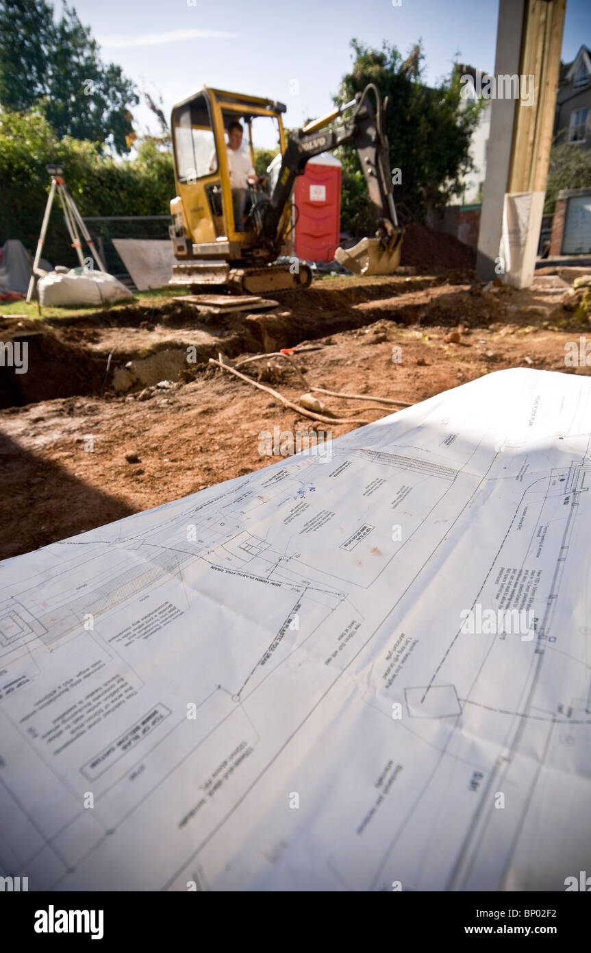 Digger preparing foundations for pouring of cement Stock Photo - Alamy