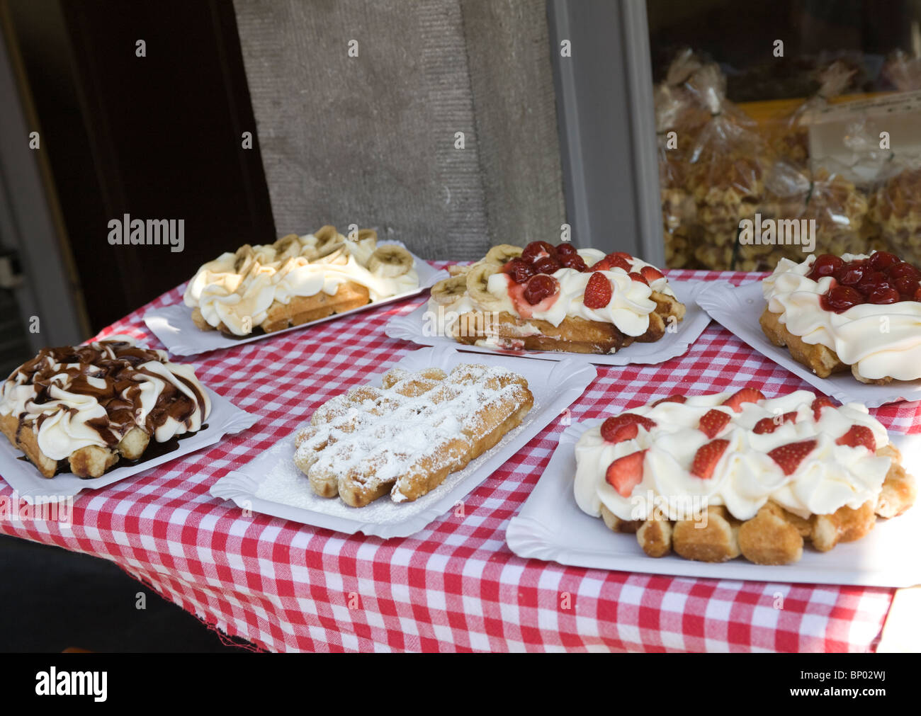 Display of Belgian waffles with a selection of different toppings Stock ...