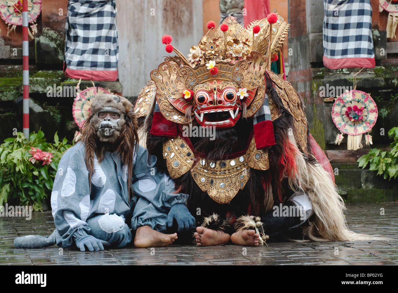 Monkey and Barong dancers in the rain during the Barong Dance in Ubud ...
