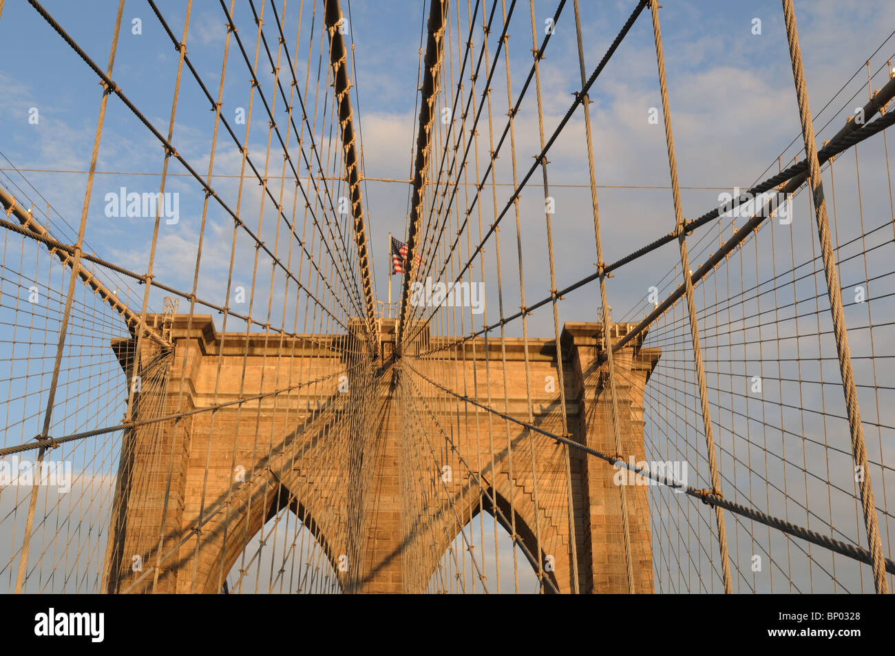 The Brooklyn Bridge spans the East River, connecting the New York City ...