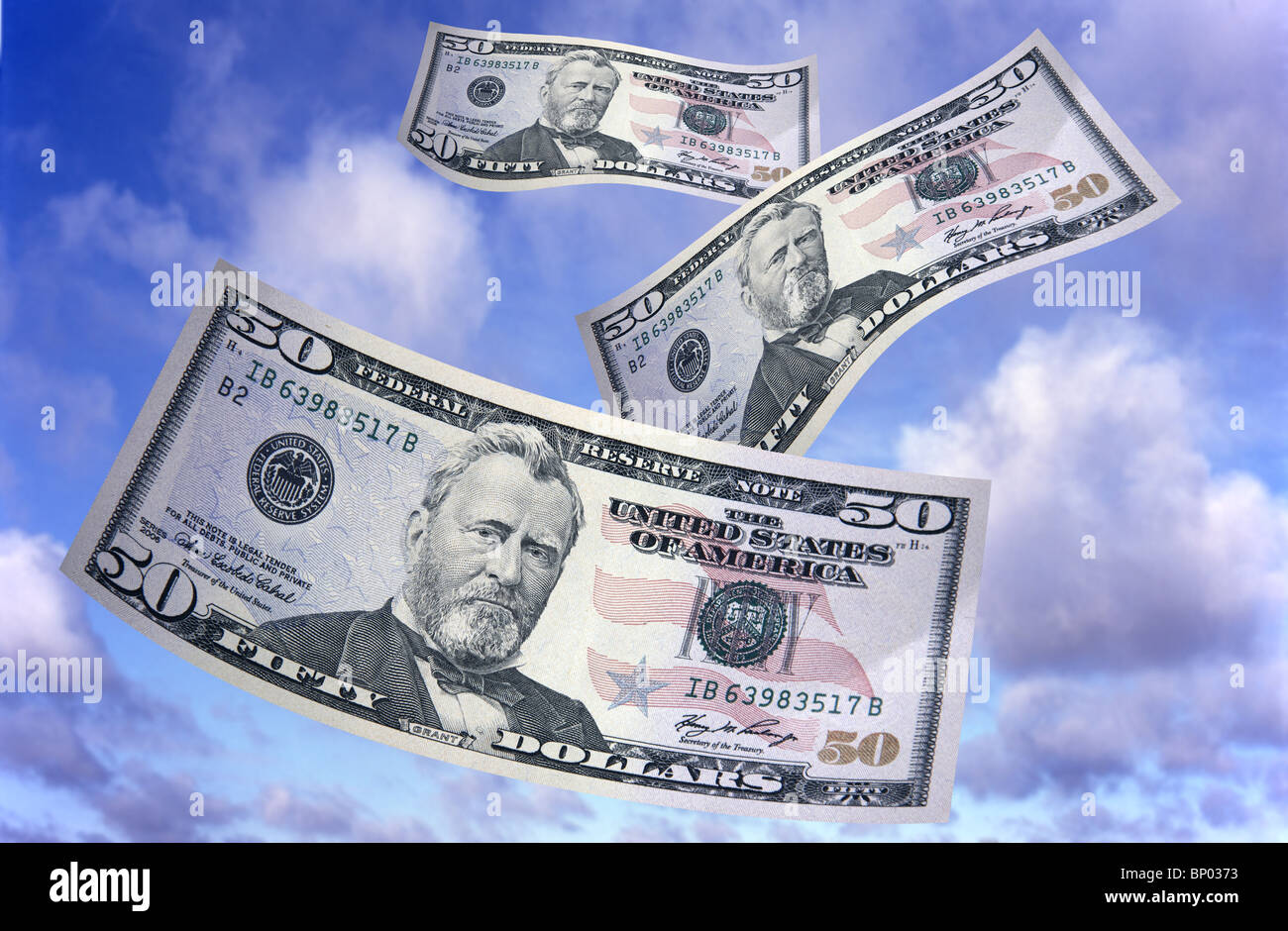 Floating dollar bank notes against a cloudy blue sky Stock Photo - Alamy