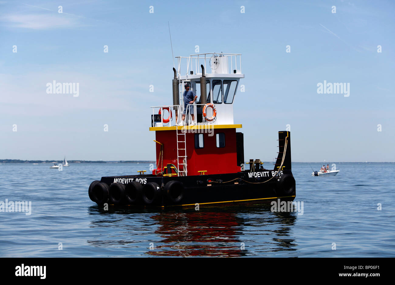 A small commercial work barge, Boston Harbor Stock Photo - Alamy