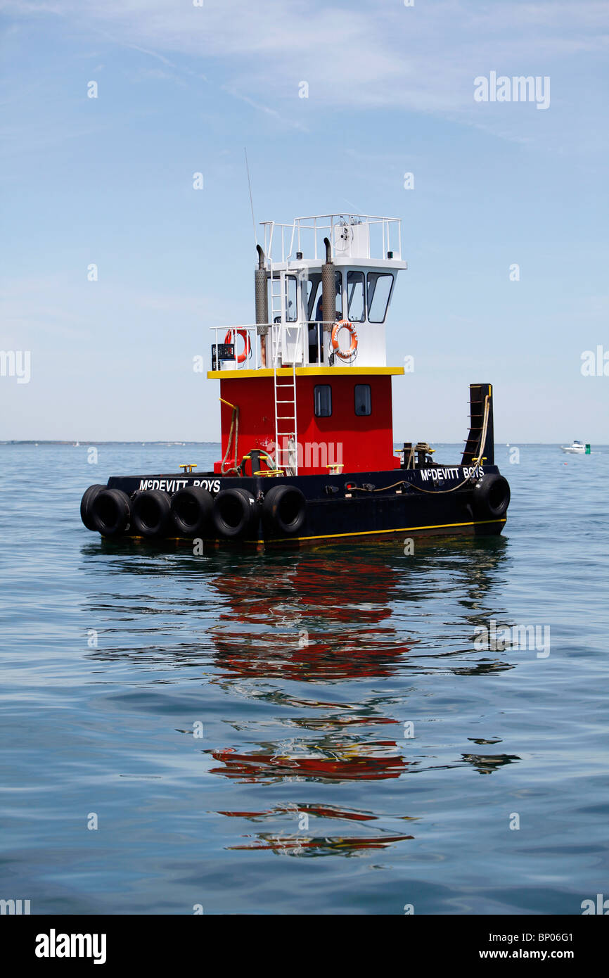 A small commercial work barge, Boston Harbor Stock Photo - Alamy
