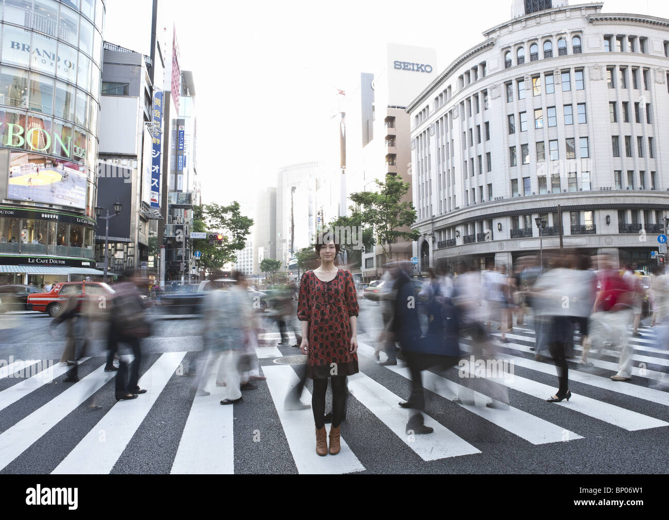 Young woman standing on steet Stock Photo - Alamy
