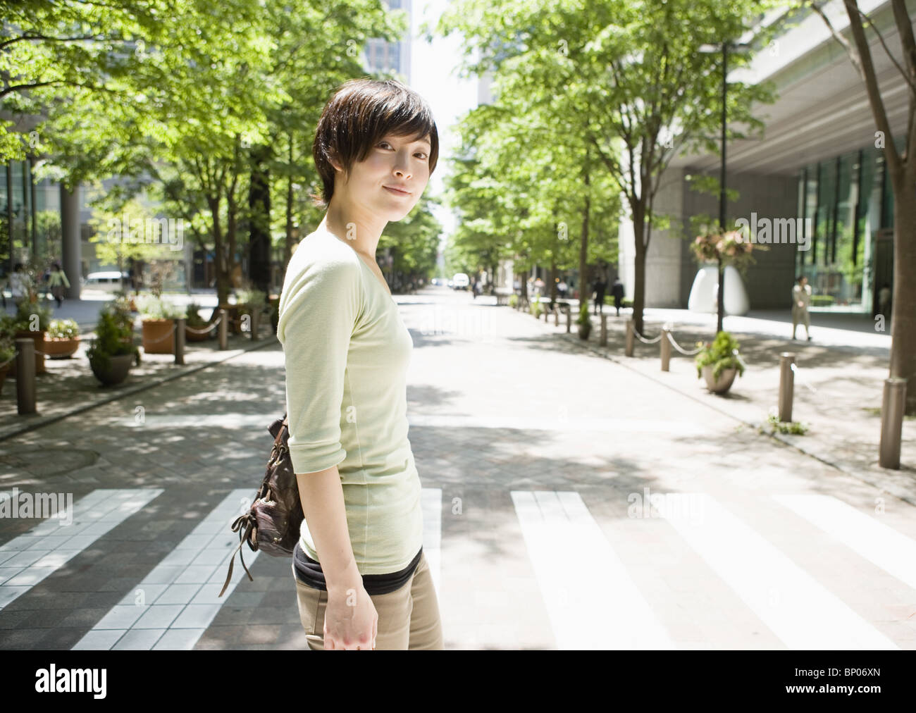 Young woman in street Stock Photo - Alamy