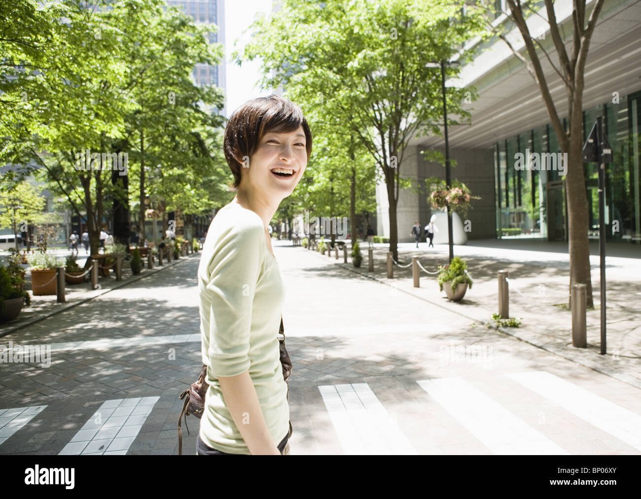 Young woman in street Stock Photo - Alamy
