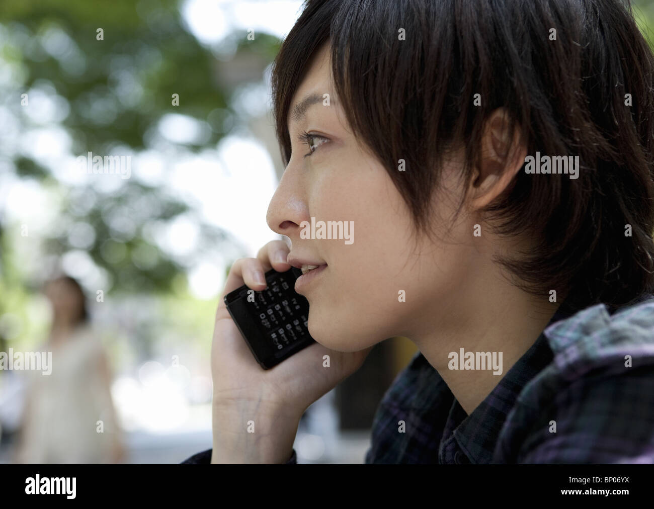 Young woman talking on the mobile phone Stock Photo - Alamy