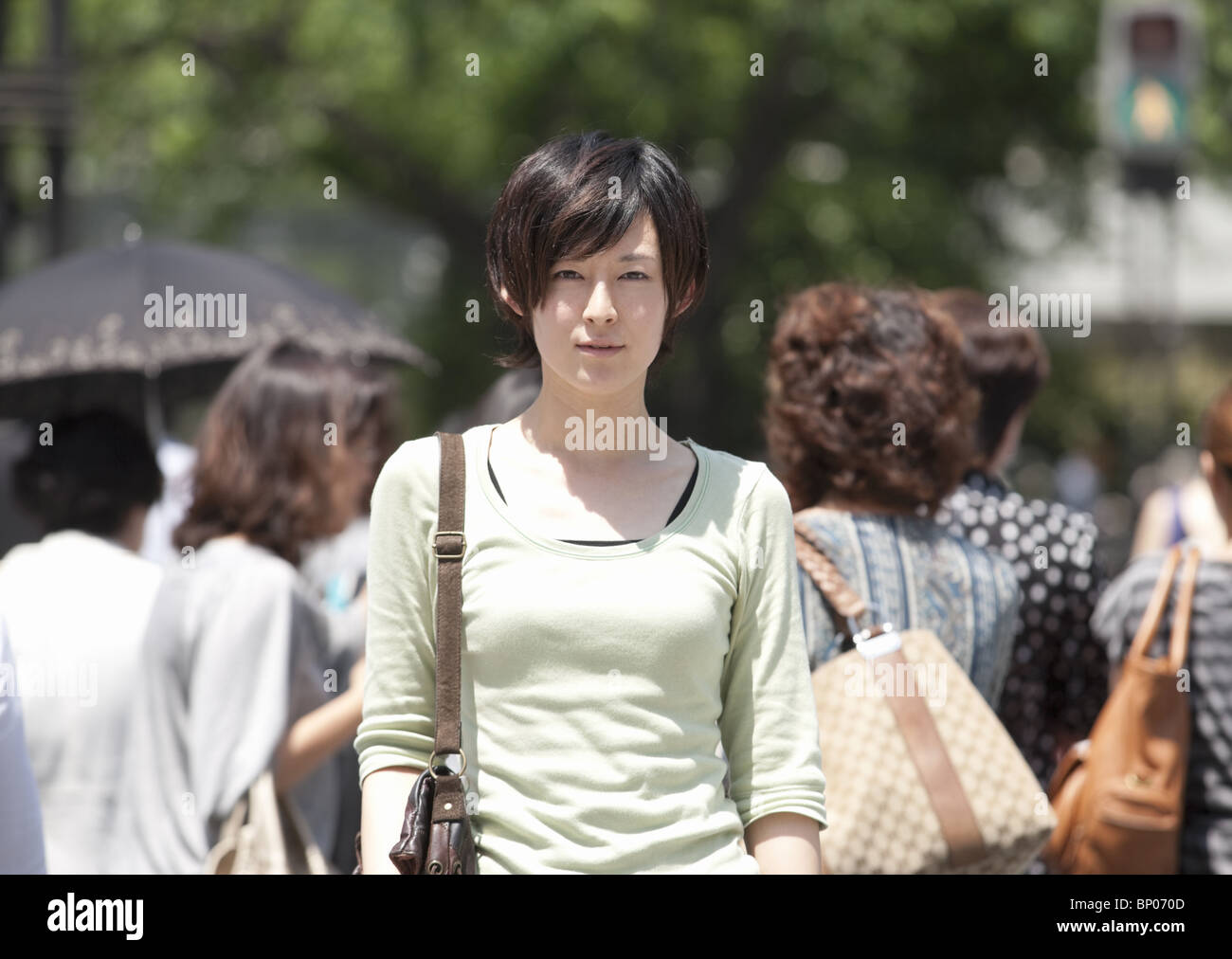Young woman in street Stock Photo - Alamy