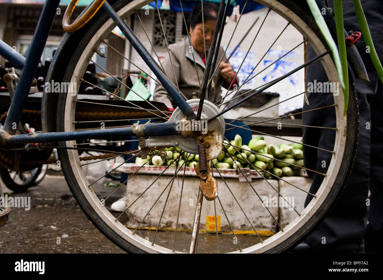 Market view through a cycle wheel Stock Photo - Alamy