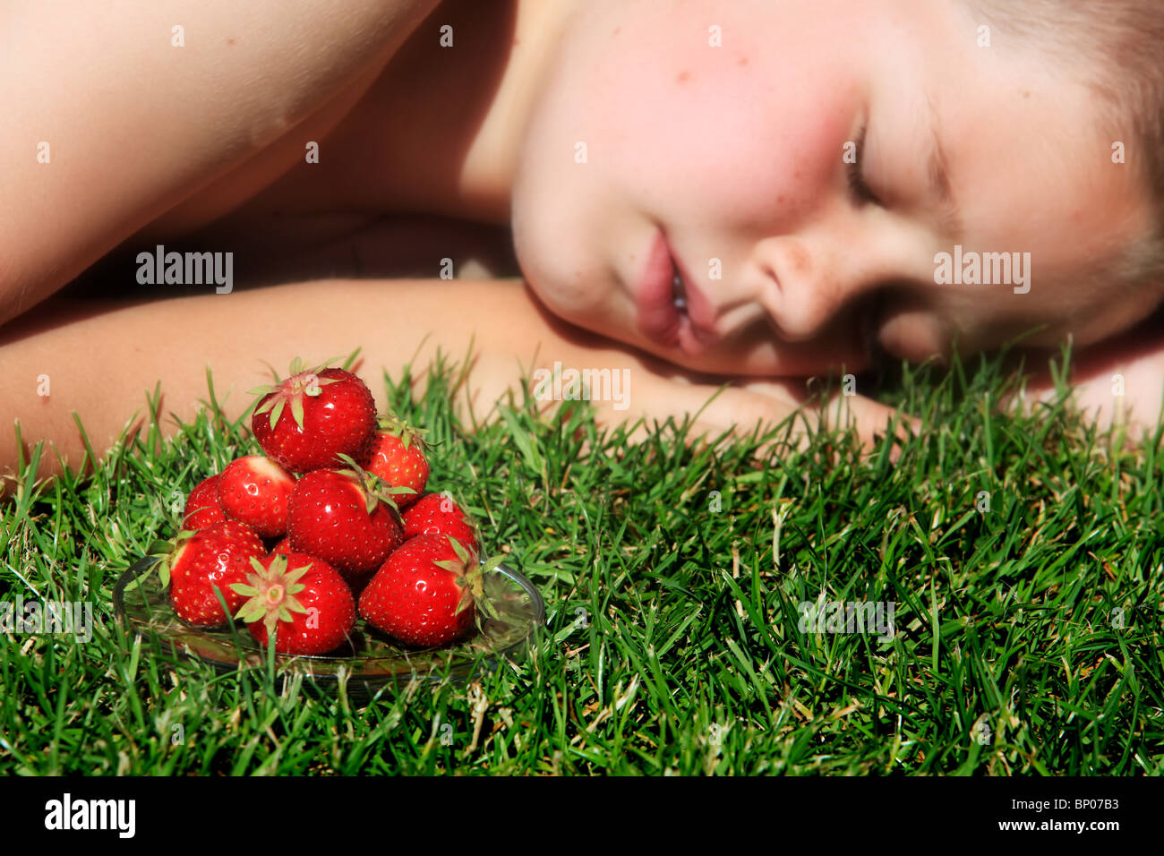Boy sleeping laying on grass hi-res stock photography and images - Alamy