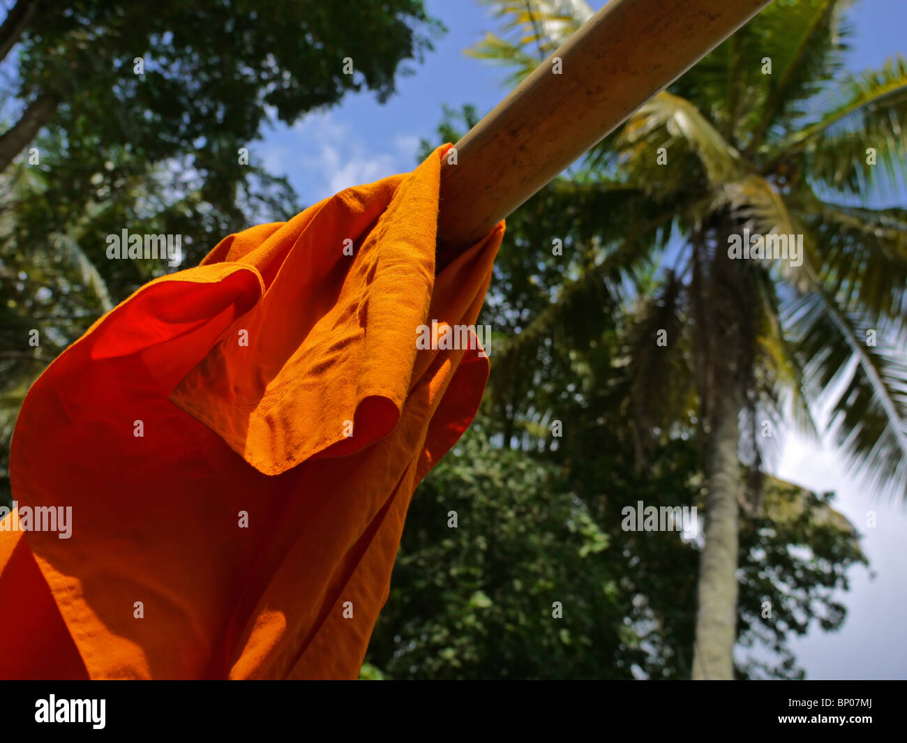 Orange monks clothes drying under the sun in the temple courtyard ...