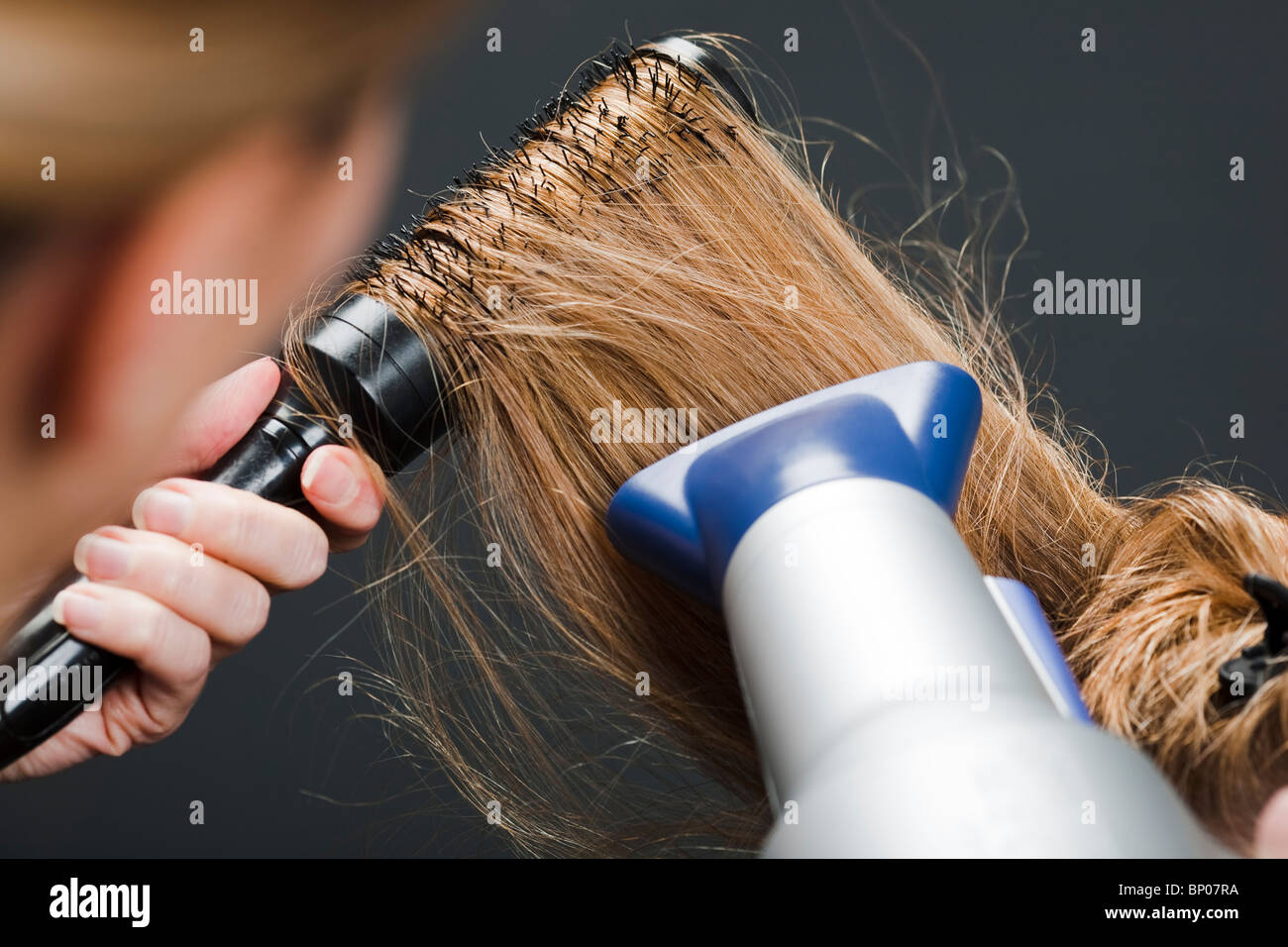 Close up woman using hair dryer hi-res stock photography and images - Alamy